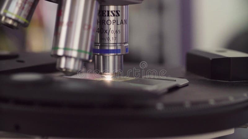 Slide Glass Under the Light Microscope Lens Stock Video - Video of ...