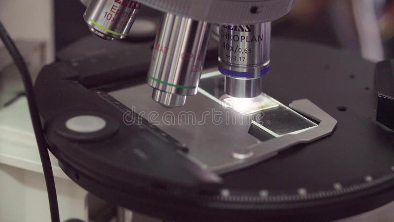 Slide Glass Under the Light Microscope Lens Stock Video - Video of ...