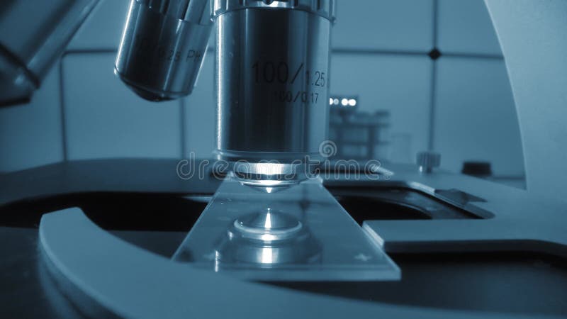 Close-up of Sample Slide on a Microscope Table. Blue Toned Stock Video ...