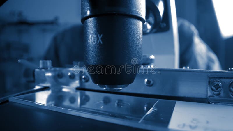 Close-up of Sample Slide on a Microscope Table. Blue Toned Stock ...