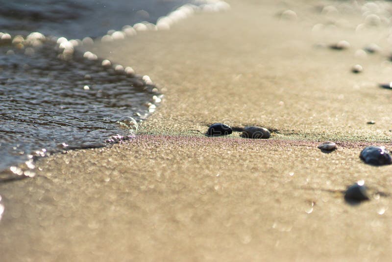 Close Up of a Sandy Beach with a Wave Coming in Stock Image - Image of ...
