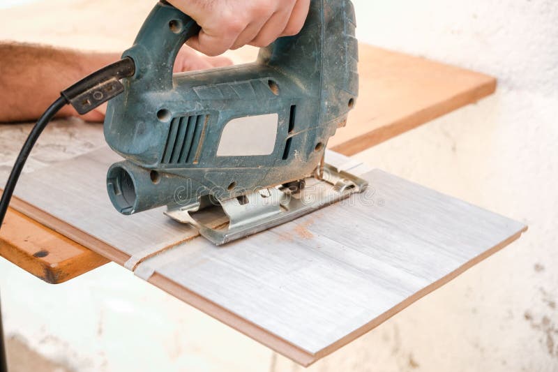 Close-up Sawing Jigsaw in the Board, the Process of Cutting the Board ...