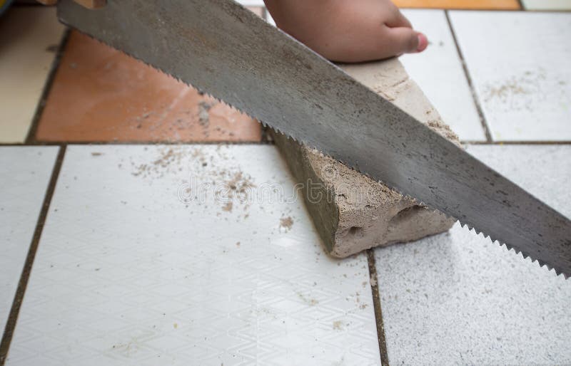 Close Up Saws Cutting Concrete Blocks Placed on a Ceramic Tile B Stock ...