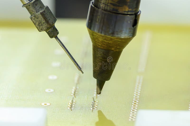 Close Up Scene the Automatic Soldering Machine Operation with PCB Board ...