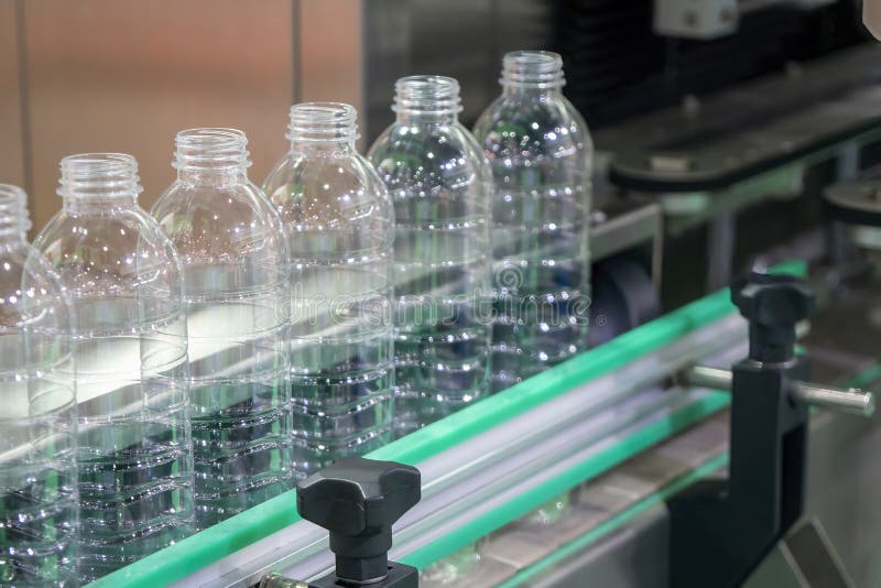 Close Up Scene of the Empty Drinking Water Bottles on the Conveyor Belt ...