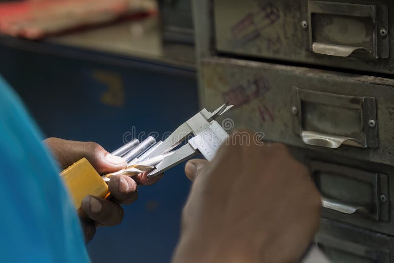 Close Up Scene the Machine Operator Measuring Outside Dimension Drill ...