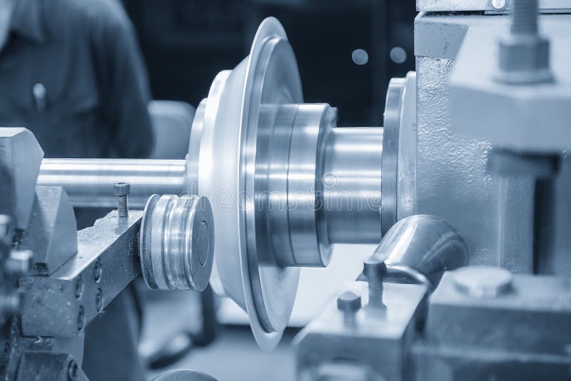 Close Up Scene the Metal Spinning Process by Lathe Machine in the Light ...