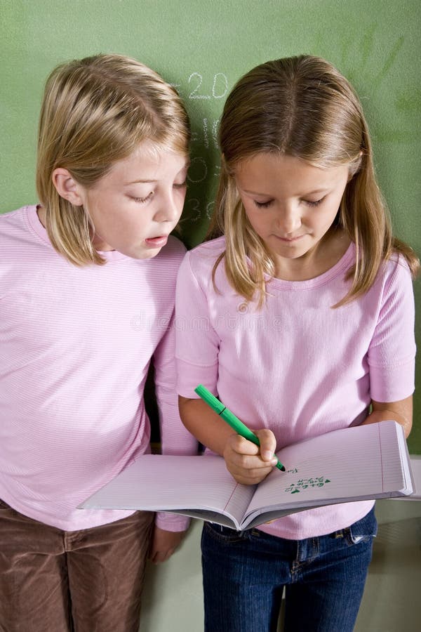 Close-up of School Girls Writing in Class Stock Photo - Image of ...