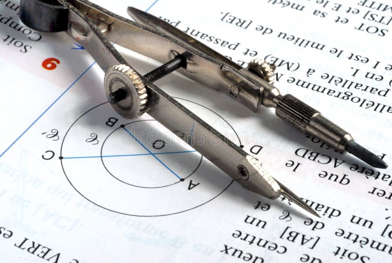Compass Resting on a Close-up Math Exercise Stock Photo - Image of ...