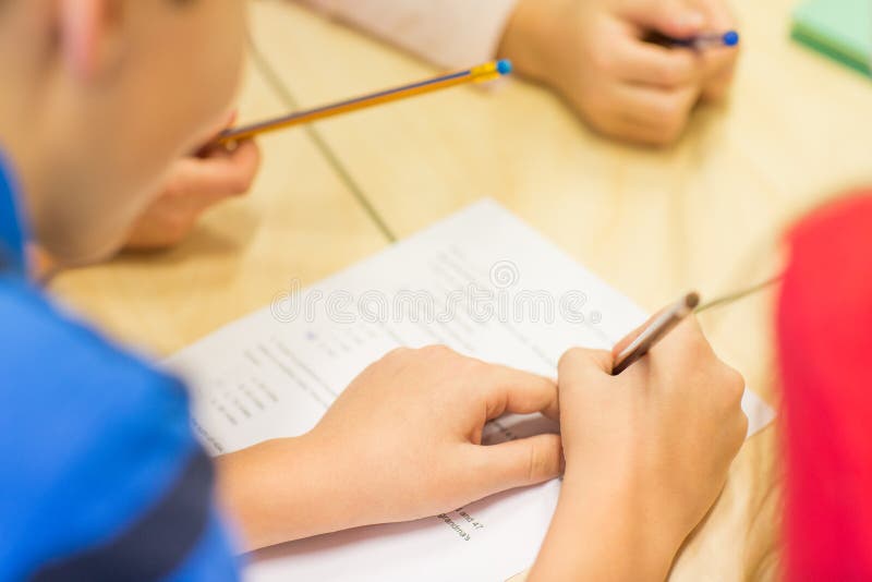 Close Up of Schoolboy Writing Test at School Stock Image - Image of ...