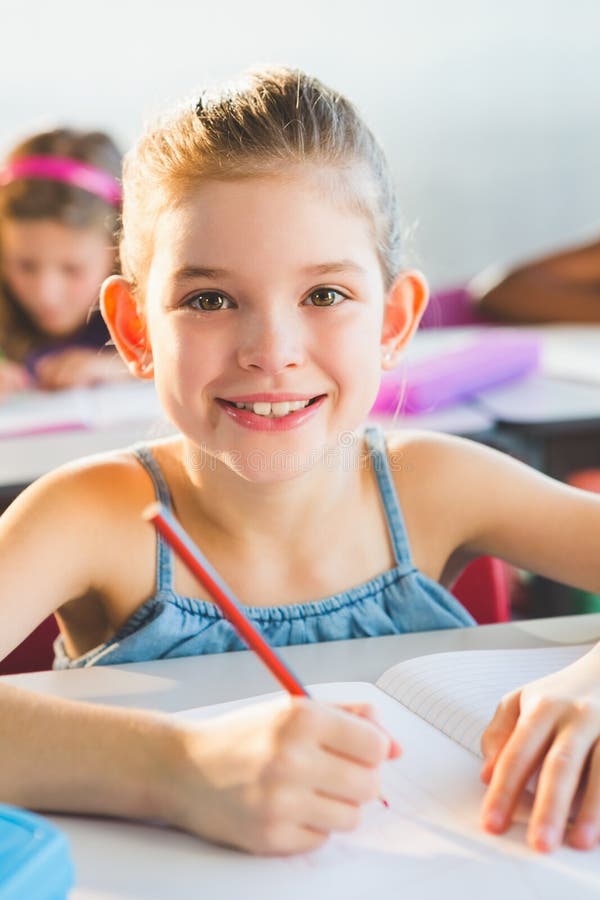 Close-up of Schoolkid Doing Homework in Classroom Stock Image - Image ...