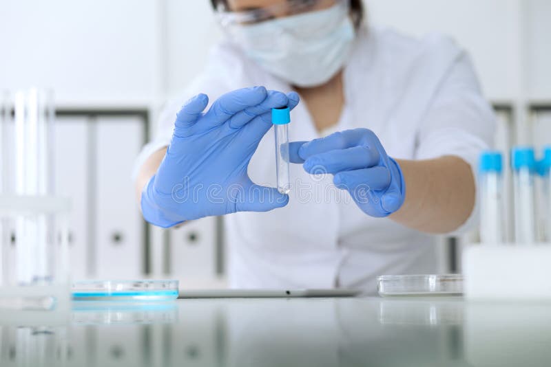 Close Up of Scientific Research Hands with Clear Solution in Laboratory ...