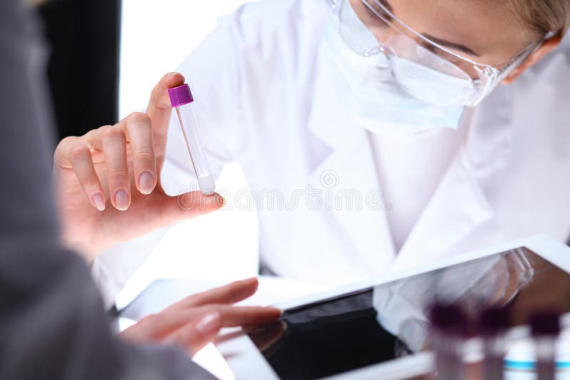 Close-up of Scientific Research Team with Clear Solution in Laboratory ...