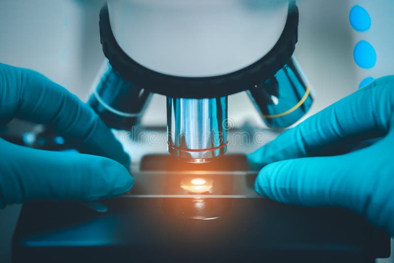 Close Up of Scientist Hands with Microscope in Medical Research Lab or ...