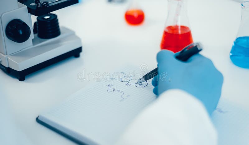 Close Up. Scientist Looking at a Drop of Blood through a Microscope ...