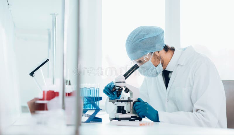 Close Up. Scientist Looking into the Eyepiece of a Microscope Stock ...