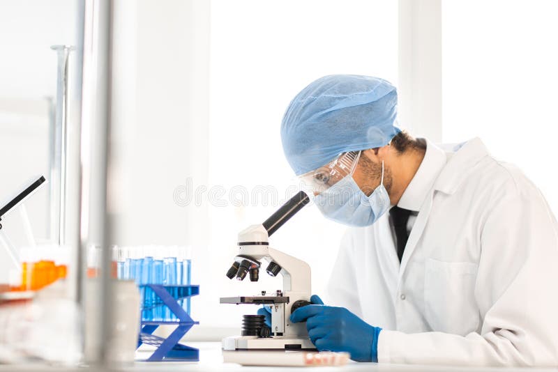 Close Up. Scientist Looking into the Eyepiece of a Microscope Stock ...