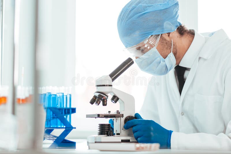 Close Up. Scientist Looking into the Eyepiece of a Microscope Stock ...