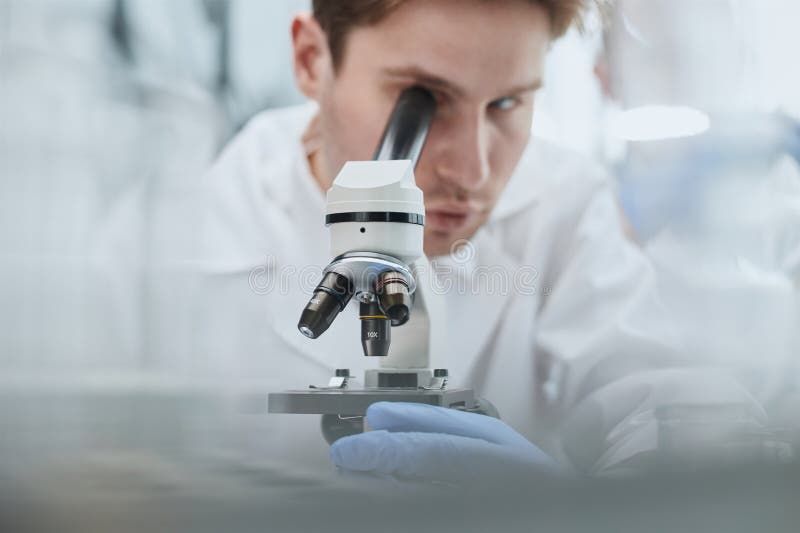 Close Up. the Scientist Looks through the Microscope Stock Photo ...
