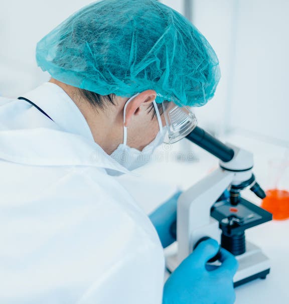 Close Up. Scientist Setting Up His Microscope To Work Stock Image ...