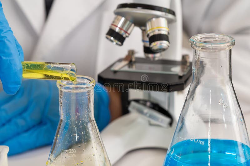 Close-up of Scientist Wearing Blue Gloves and Using Laboratory Tools ...