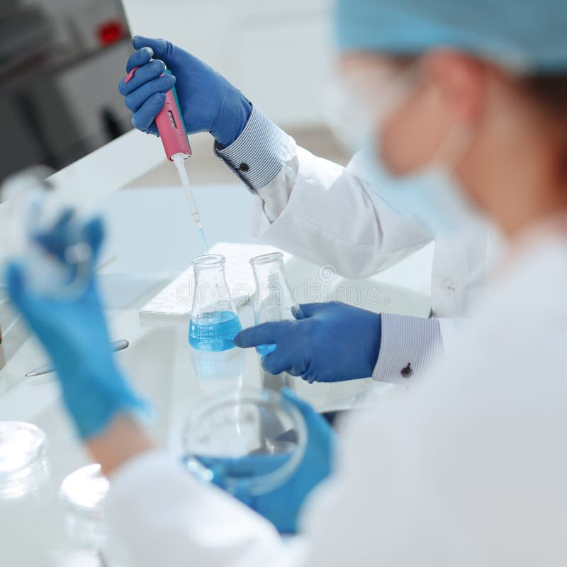 Close Up. Scientists Examining Liquid Samples in the Lab Stock Photo ...