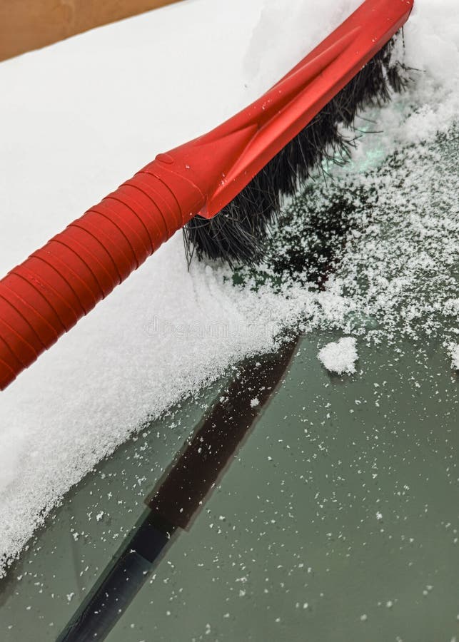 Close-up of Scraper Brush Being Used To Remove Snow from Car Windshield ...