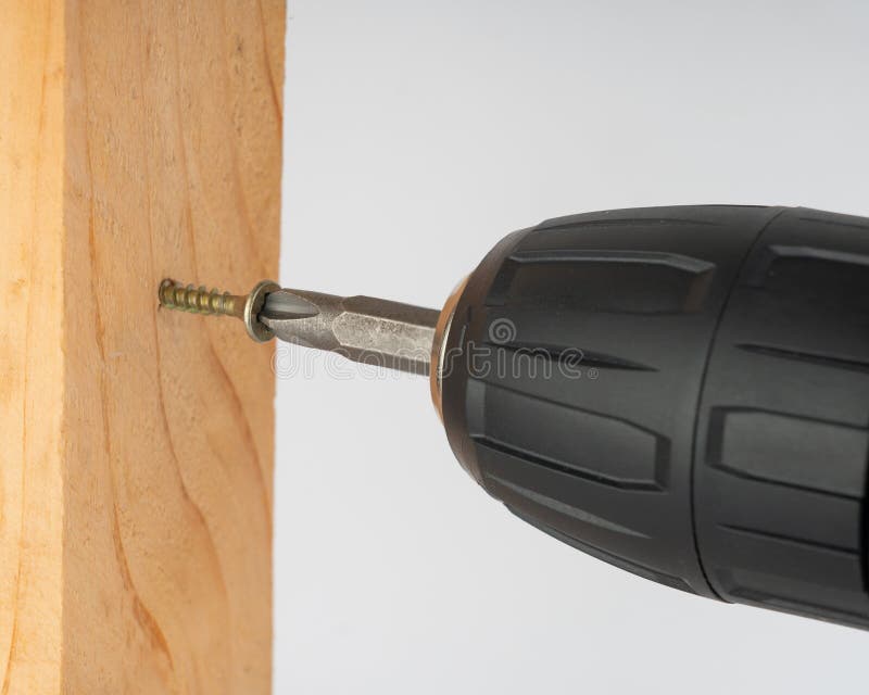 The Screwdriver Screws the into the Board Stock Image - Image of ...