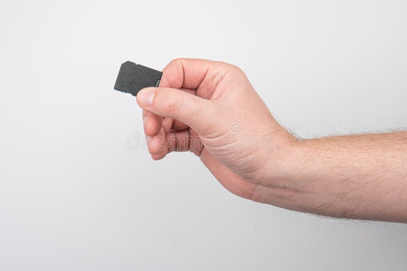 Close Up SD Memory Card in Fingers Stock Photo - Image of backup ...