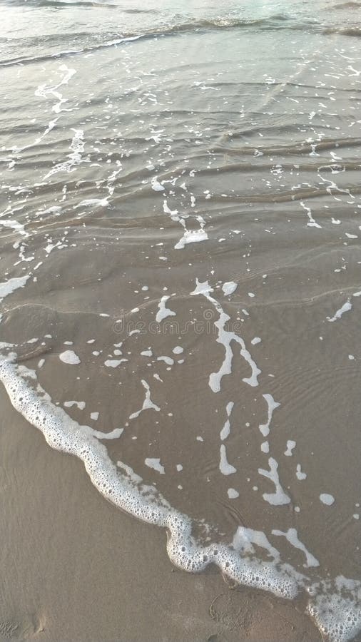 Close-up of Sea Foam on Sandy Beach with Soft Waves Stock Photo - Image ...