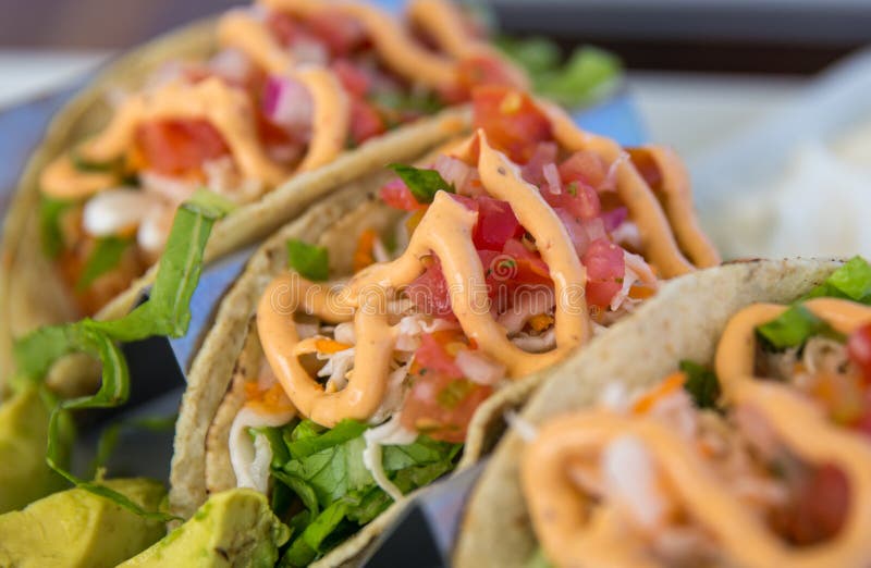 Close Up of Seafood Taco Trio Stock Image - Image of lettuce, cabbage ...