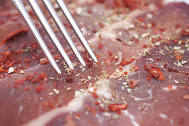 Close-Up of Seasoned Raw Meat with Metal Fork Stock Photo - Image of ...