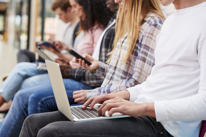 Close Up of Seated College Students Using Digital Technology Stock ...