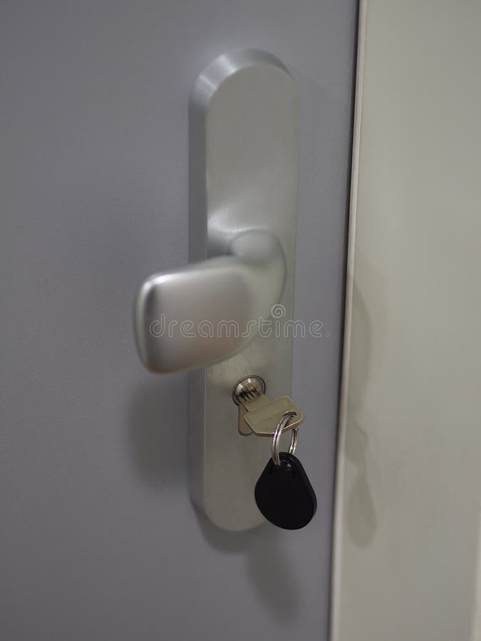 Close Up Security Key with Chip in Lock in Modern Silver Apartment ...