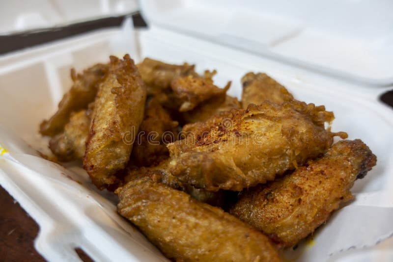 Close Up, Selective Focus on an Order of Crispy Chicken Wings in a ...
