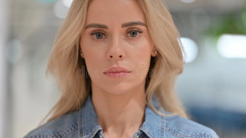 Close Up, Serious Young Woman Looking at Camera Stock Photo - Image of ...