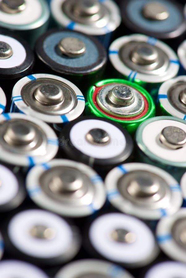 Close-up of AA Batteries on a Smooth Surface. Focus on Battery Detail ...