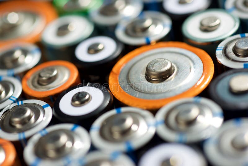Close-up of AA Batteries on a Smooth Surface. Focus on Battery Detail ...