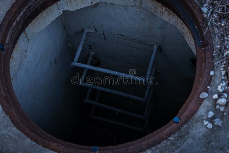Close-up of a Sewer Drain Featuring a Ladder at the Bottom with No ...