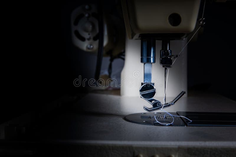 Close-up of a Sewing Machine on a Dark Background with Backlight ...