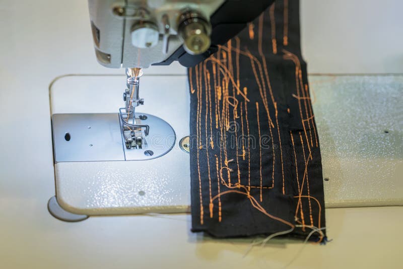 Close-up of Sewing Machine Needle and Fabric Stitched with Threads ...