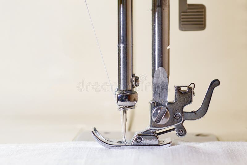 Close-up of a Sewing Machine and a Sewing Needle. Foot and Needle of a ...