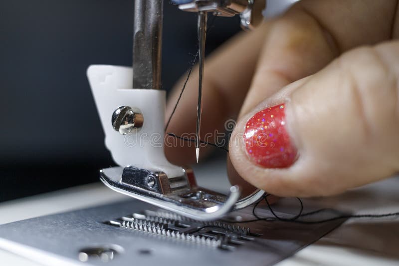 Close-Up of Sewing Machine Needle and Threading Process. Stock Photo ...