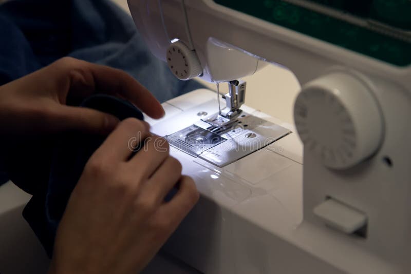 Close Up of Sewing Machine on the Table in the Night Stock Photo ...