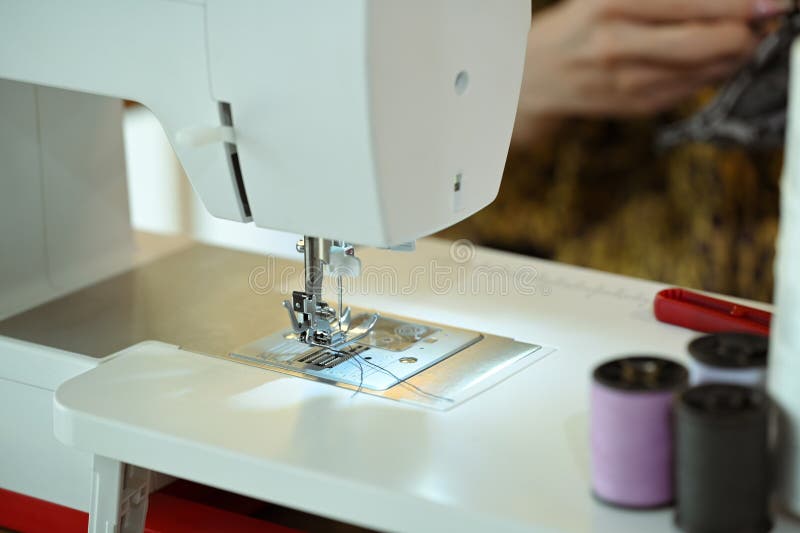 Close Up of a Sewing Machine with Thread and Fabric at Fashion Designer ...