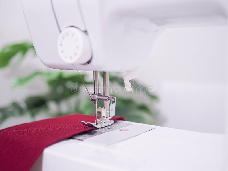 Close Up of Sewing Machine Working with Red Fabric, Stitch New Clothing ...