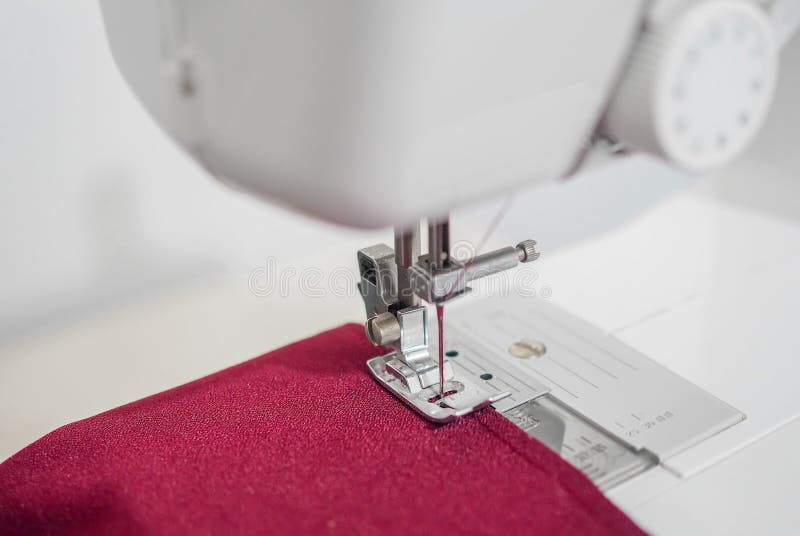 Close Up of Sewing Machine Working with Red Fabric, Stitch New Clothing ...