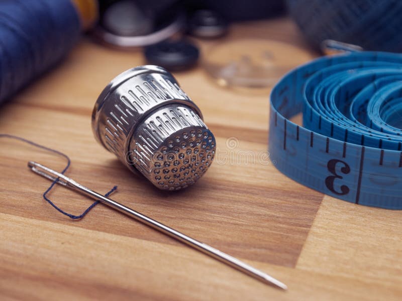Close-up of a Sewing Needle and Thimble. Detailed Images of Sewing ...