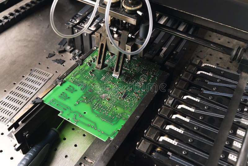 Close Up of SFD Surface-mount Device Working on PCB Printed Circuit ...