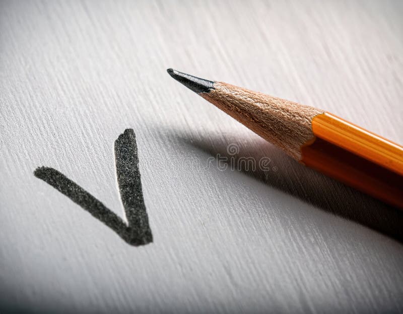 Close-up of a Sharpened Pencil beside a Check Mark on Paper Stock ...